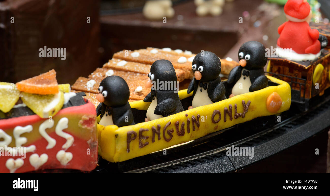 Marzipan penguins riding train, in gingerbread village Stock Photo - Alamy