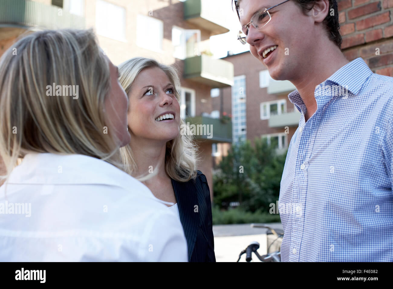 Three friends talking, Sweden Stock Photo - Alamy
