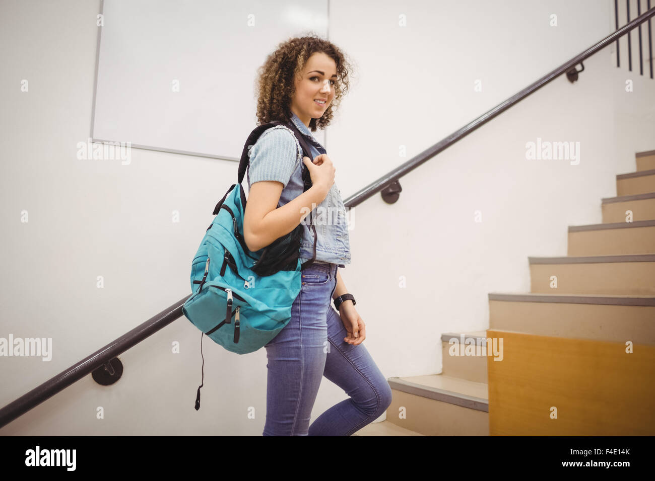 Pretty student on the stairs Stock Photo - Alamy