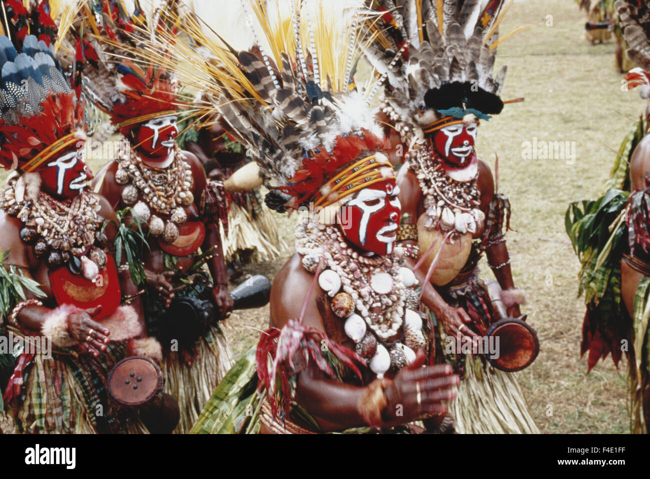 Papua New Guinea, Tribal woman playing bongo drums. (Large format sizes ...