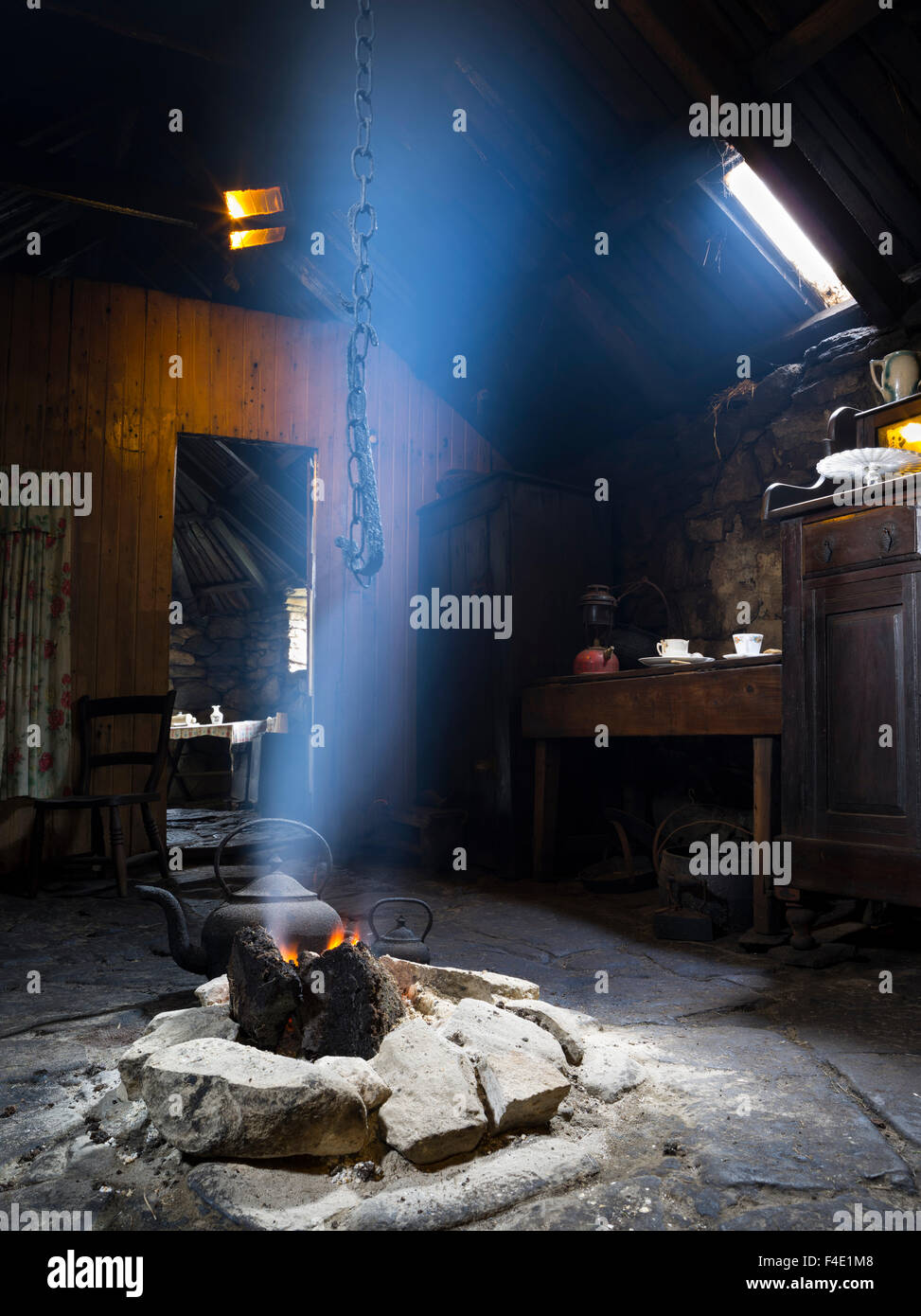 Arnol Blackhouse No 42 on the Isle of Lewis. Open peat fire in the living room, kitchen. (Large ...