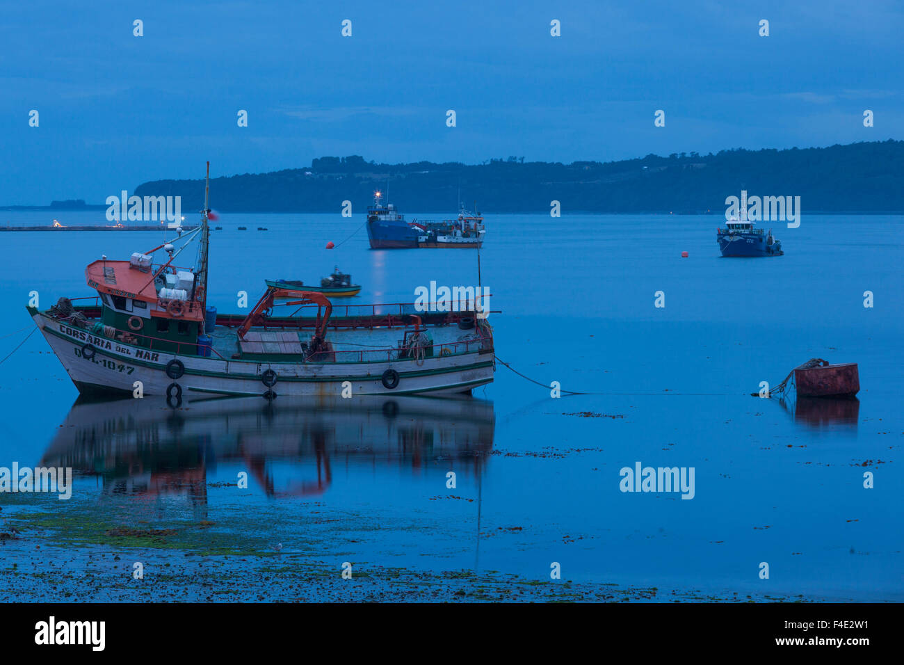 Chile, Chiloe Island, Quellon, waterfront at dusk Stock Photo - Alamy