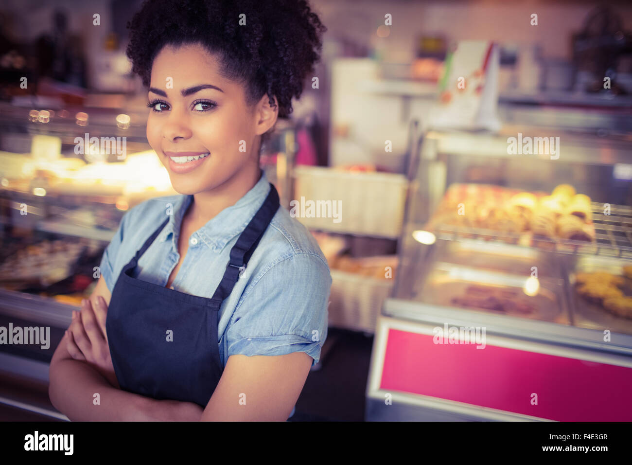 Pretty waitress smiling at camera Stock Photo - Alamy