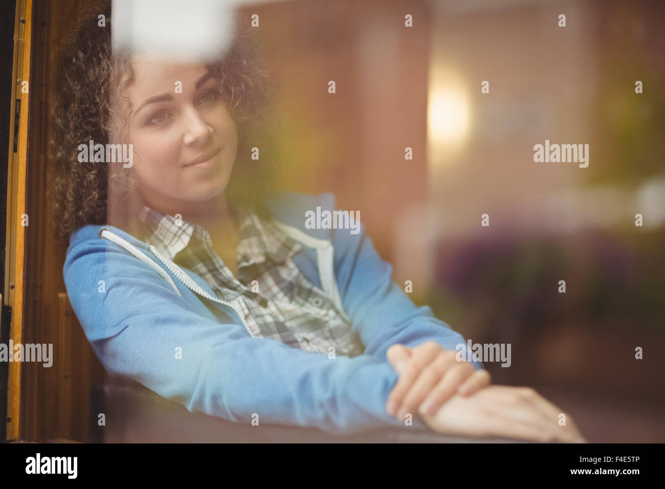 Pretty student sitting by the window Stock Photo - Alamy