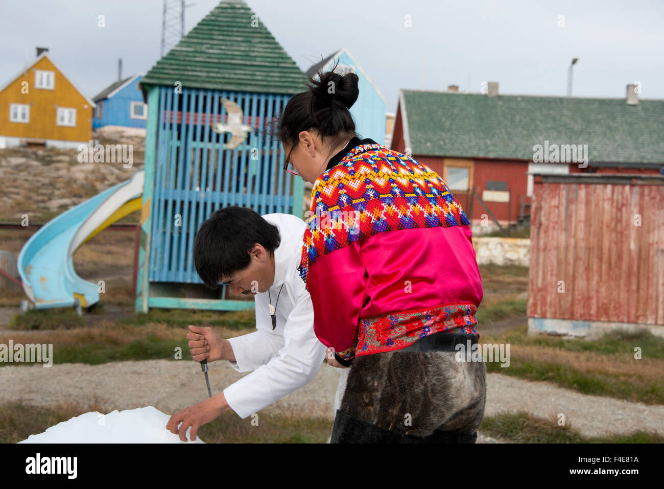 Greenland, Disko Bay, Saqqaq. Couple, in traditional Greenlandic attire ...
