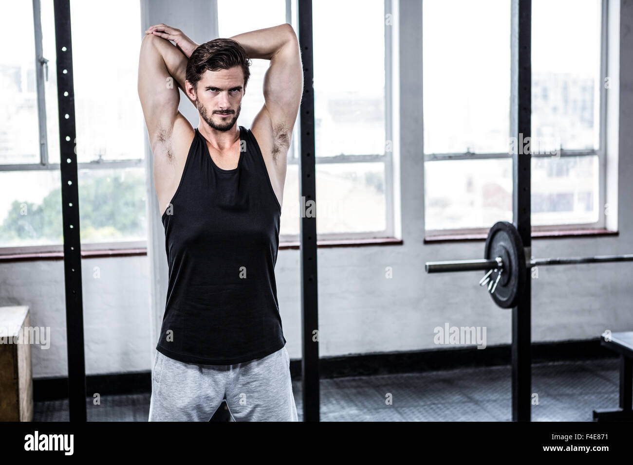 Fit man stretching his arms Stock Photo - Alamy