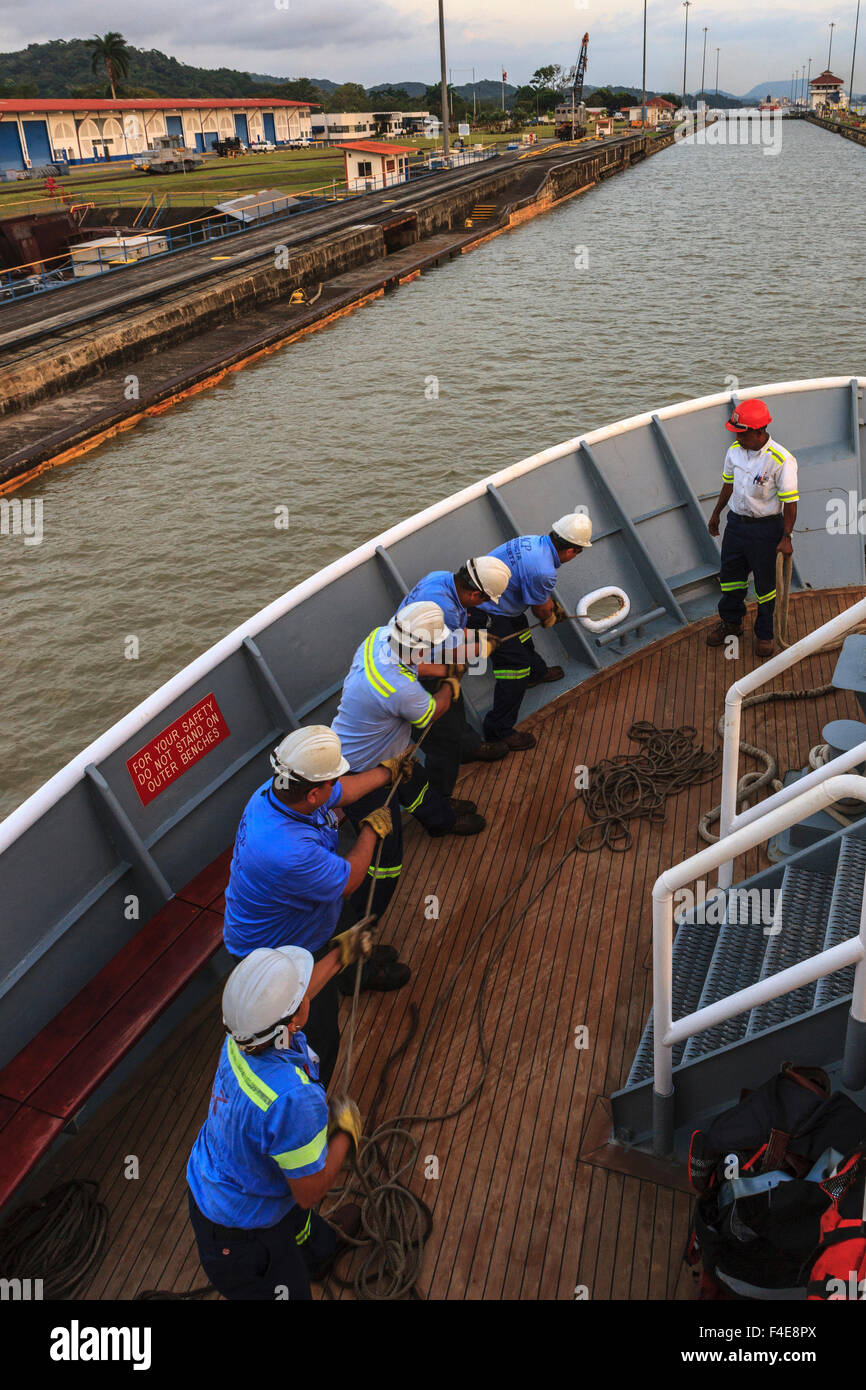 Workers keeping the towing lines taut. Panama Canal. Panama. Central ...