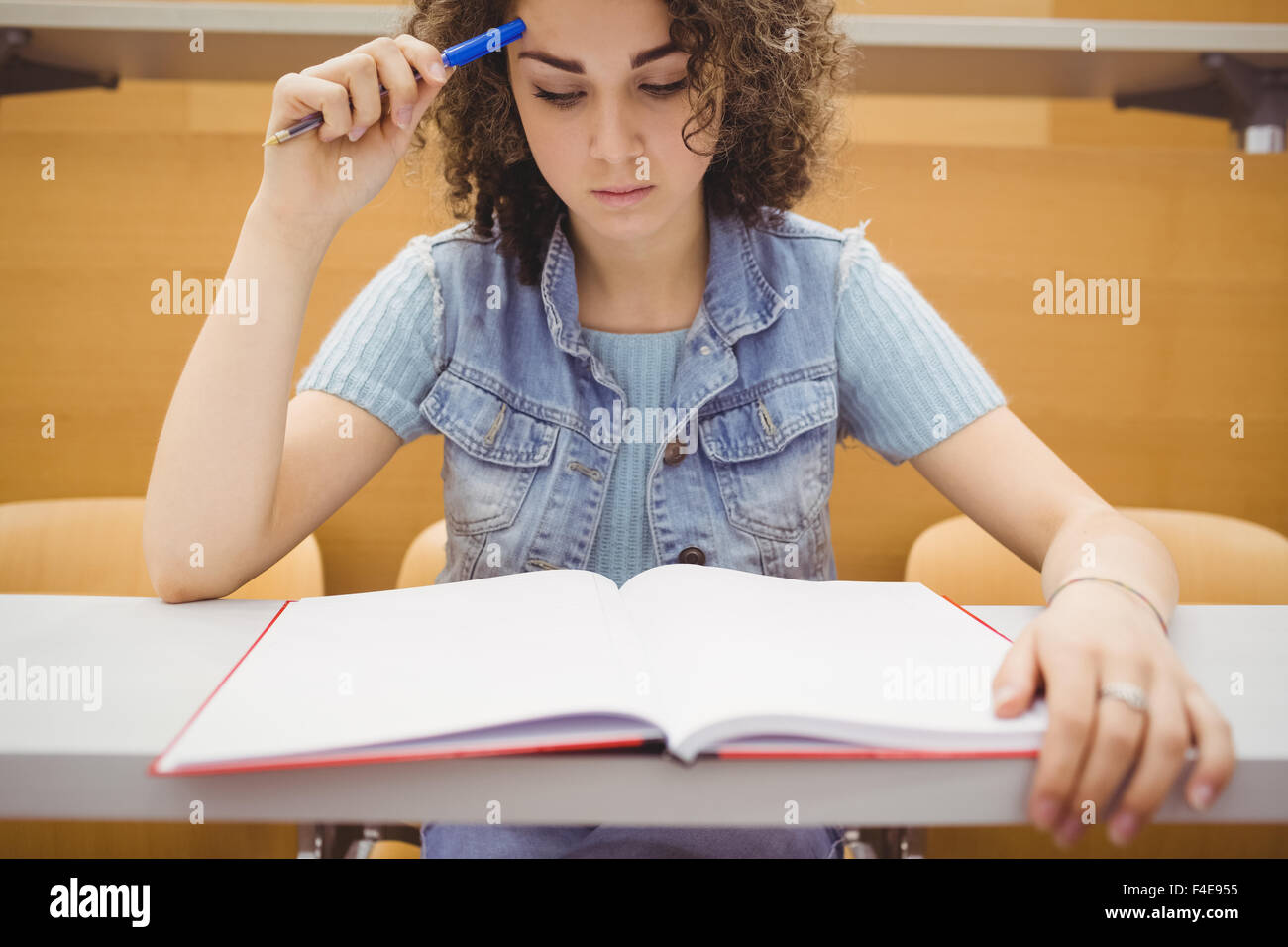 Pretty student in lecture hall Stock Photo - Alamy