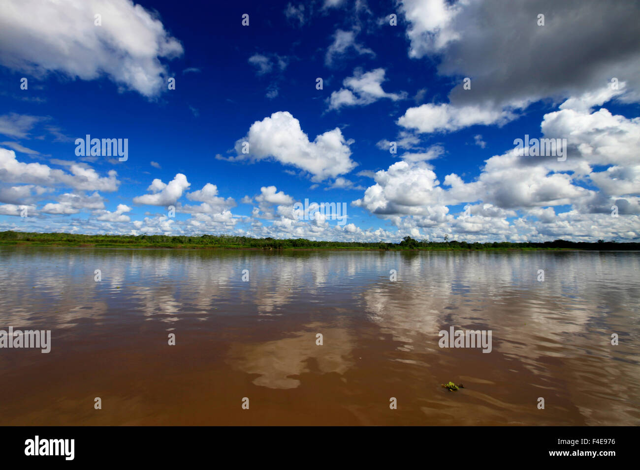 South America, Peru, Amazon. Cloud reflections on Amazon river Stock ...