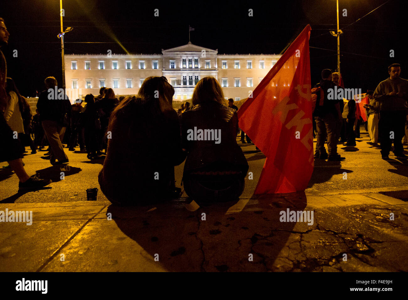 Athens, Greenland. 16th Oct, 2015. Two women with a flag sit opposite ...