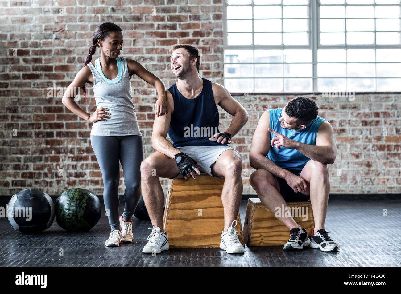 Fit smiling people posing together Stock Photo - Alamy
