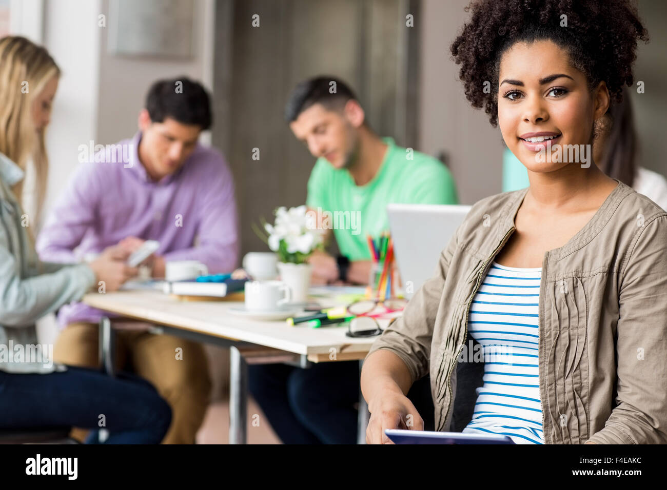 Student working on assignment with tablet Stock Photo - Alamy
