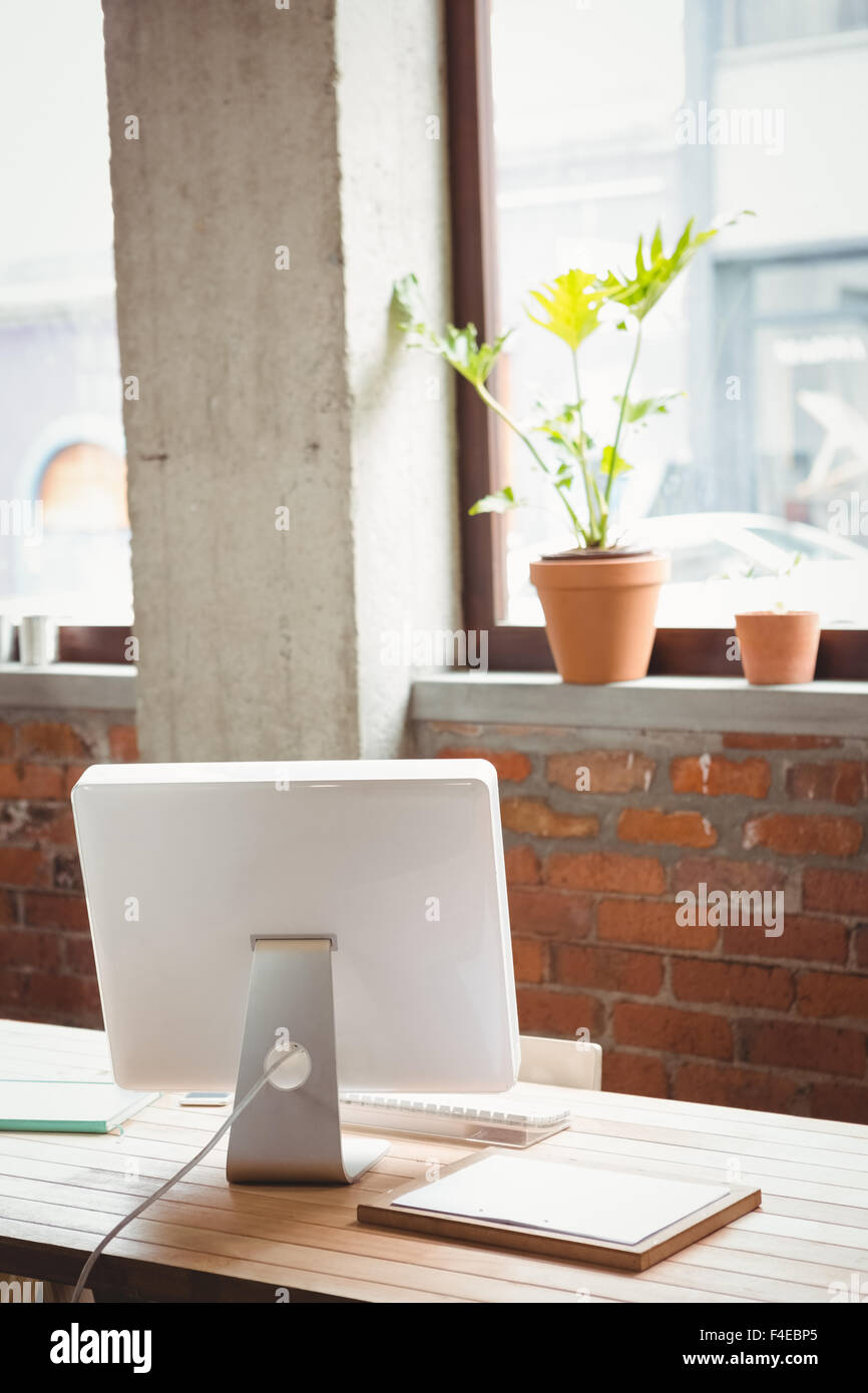 Computer on table at office Stock Photo - Alamy