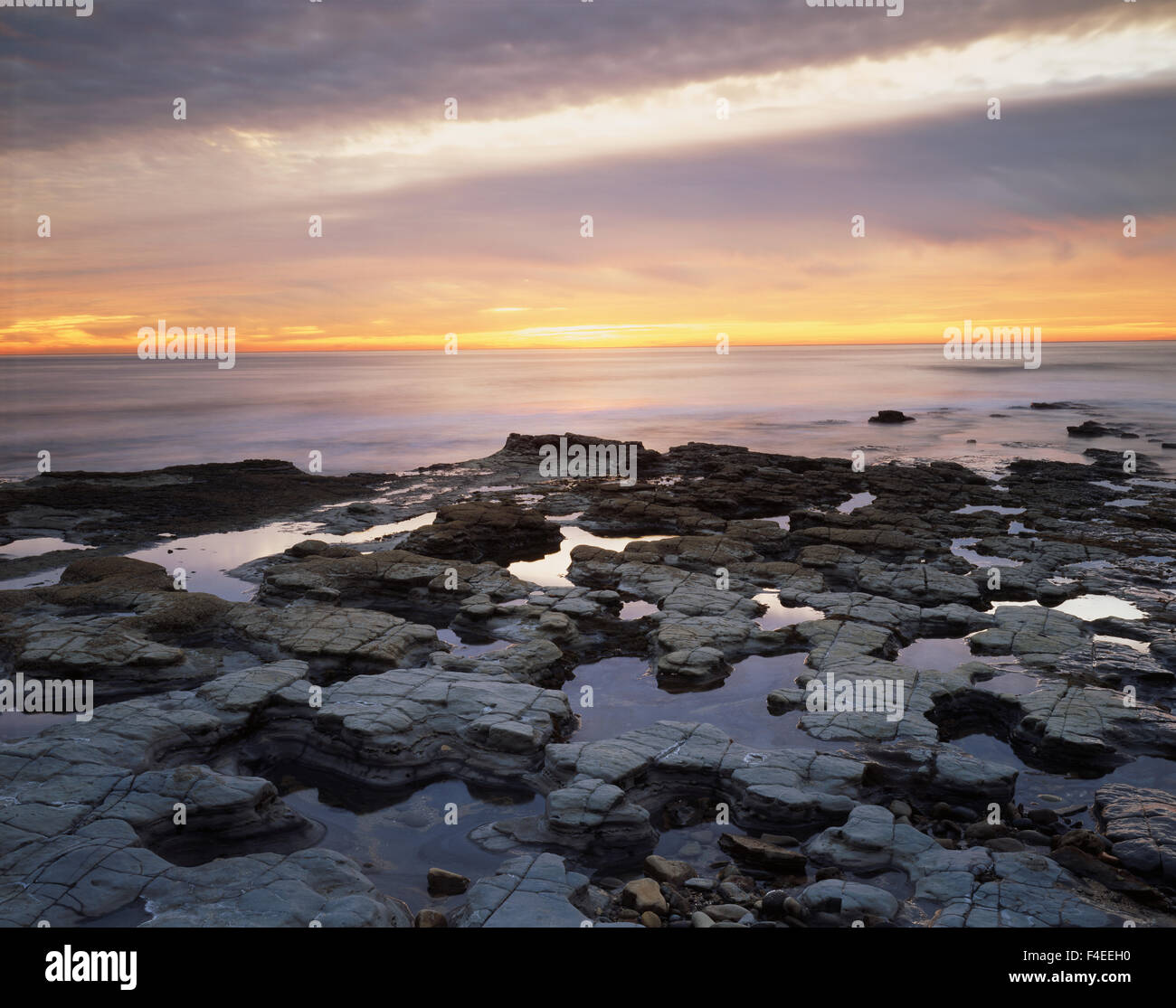 California, San Diego, Sunset Cliffs, Sunset over tide pools on the ...