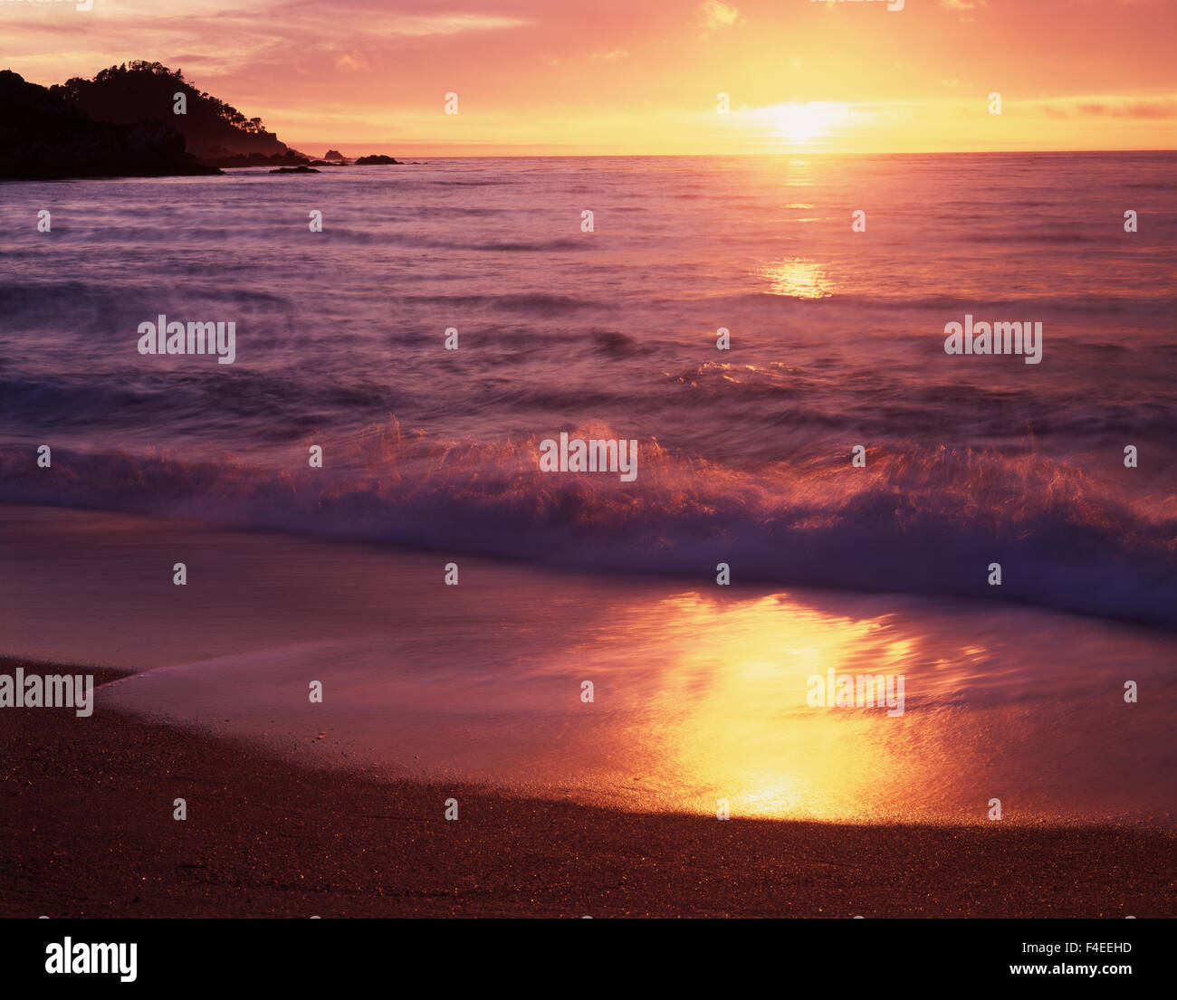 California, Point Lobos, Sunset over a beach on the Pacific Ocean ...