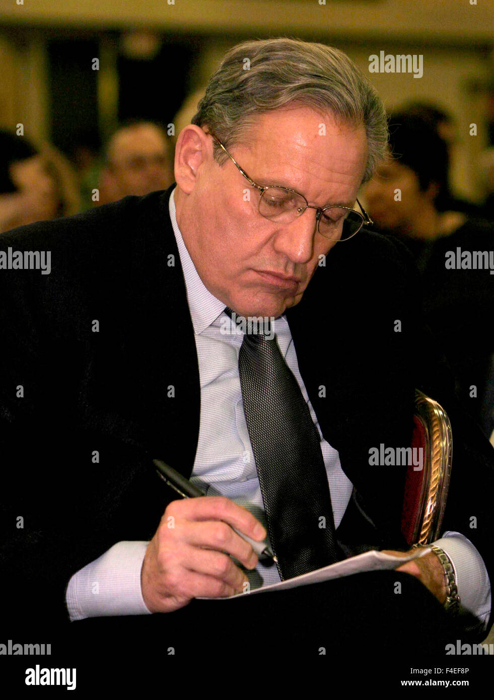 Washington Post reporter and author Bob Woodward takes notes as ...