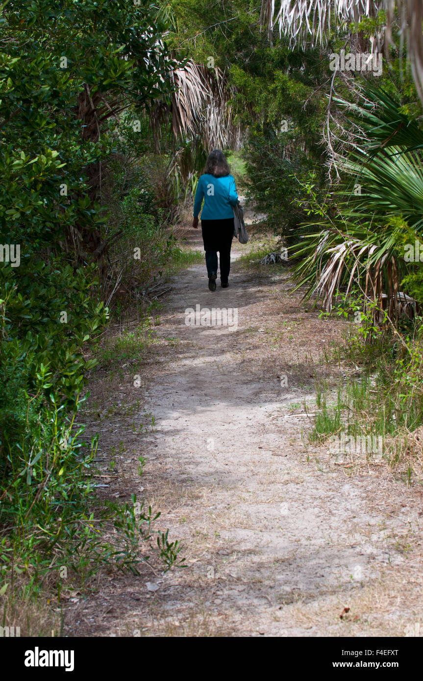 USA, Florida. Woman Hiker on Cedar Key Railroad Trestle Nature Trail ...