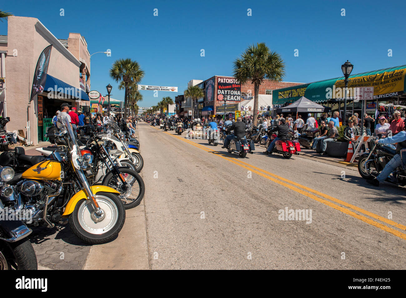 USA, Florida, Daytona Beach, Bike Week, bikers riding down Main Street ...