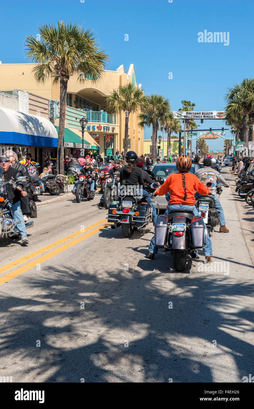 USA, Florida, Daytona Beach, Bike Week, bikers riding down Main Street ...