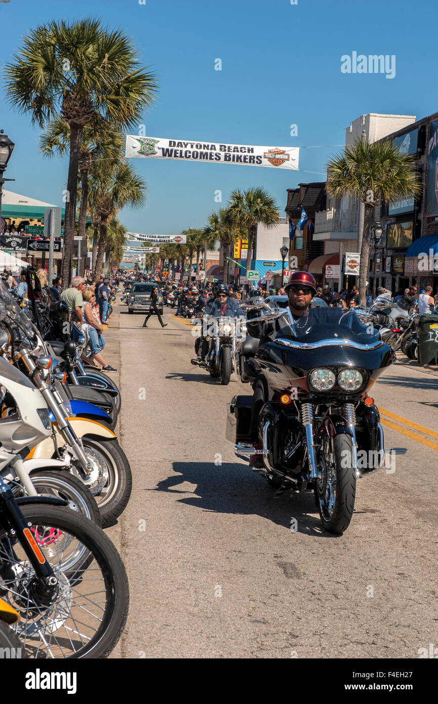 USA, Florida, Daytona Beach, Bike Week, bikers riding down Main Street ...