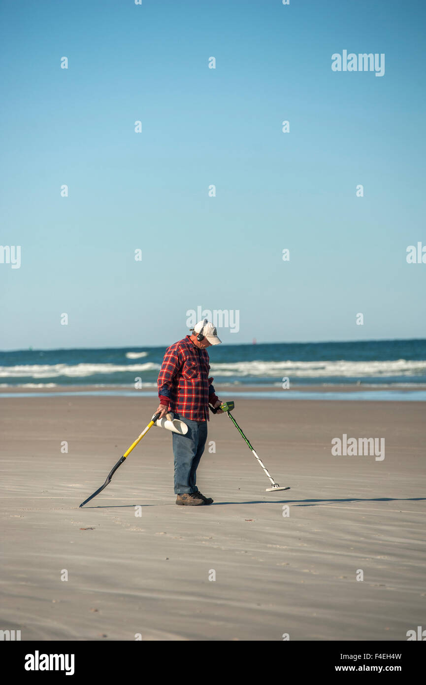 USA, Florida, New Smyrna Beach, man using metal detector Stock Photo ...