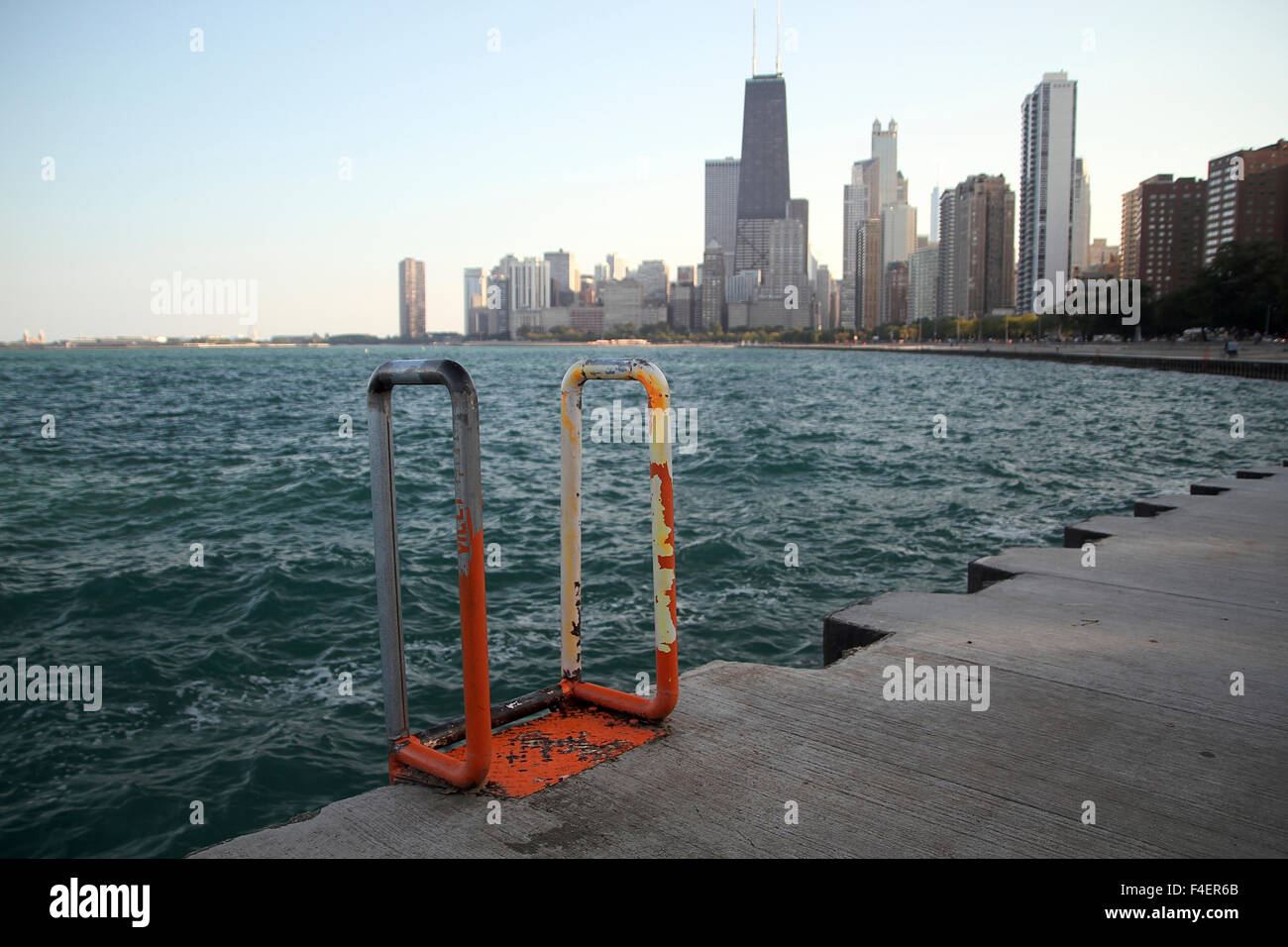 A weathered metal structure used to climb from a concrete platform into ...