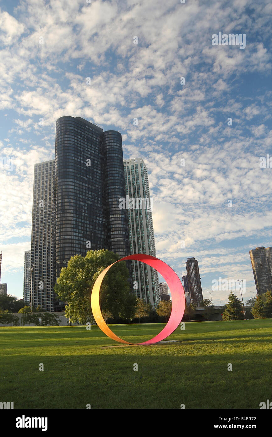 An abstract sculpture, skyscrapers in the background, Chicago, Illinois ...