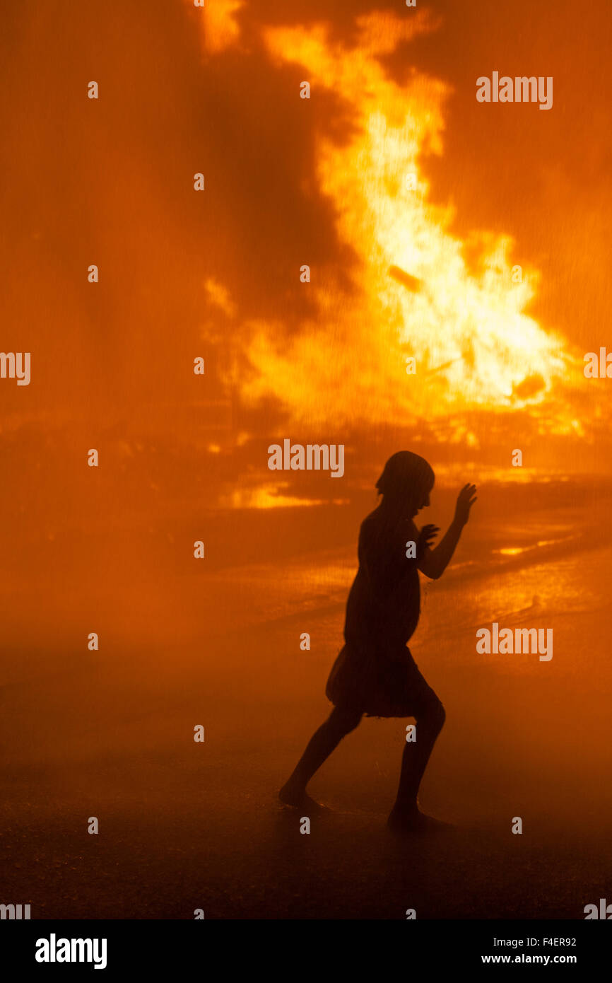 Massachusetts, Cape Ann, Rockport, Fourth of July Bonfire, silhouettes ...