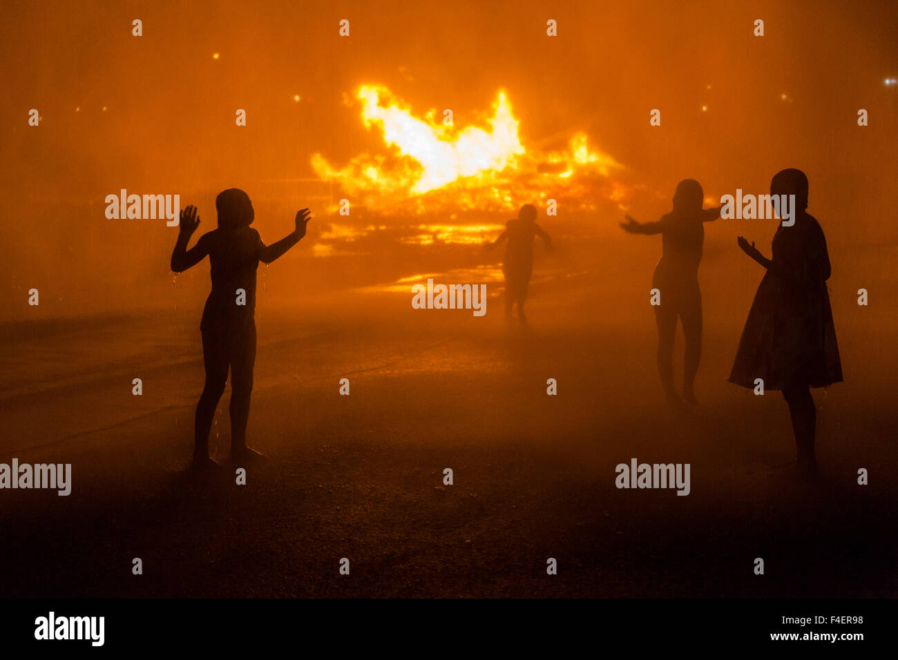 Massachusetts, Cape Ann, Rockport, Fourth of July Bonfire, silhouettes ...