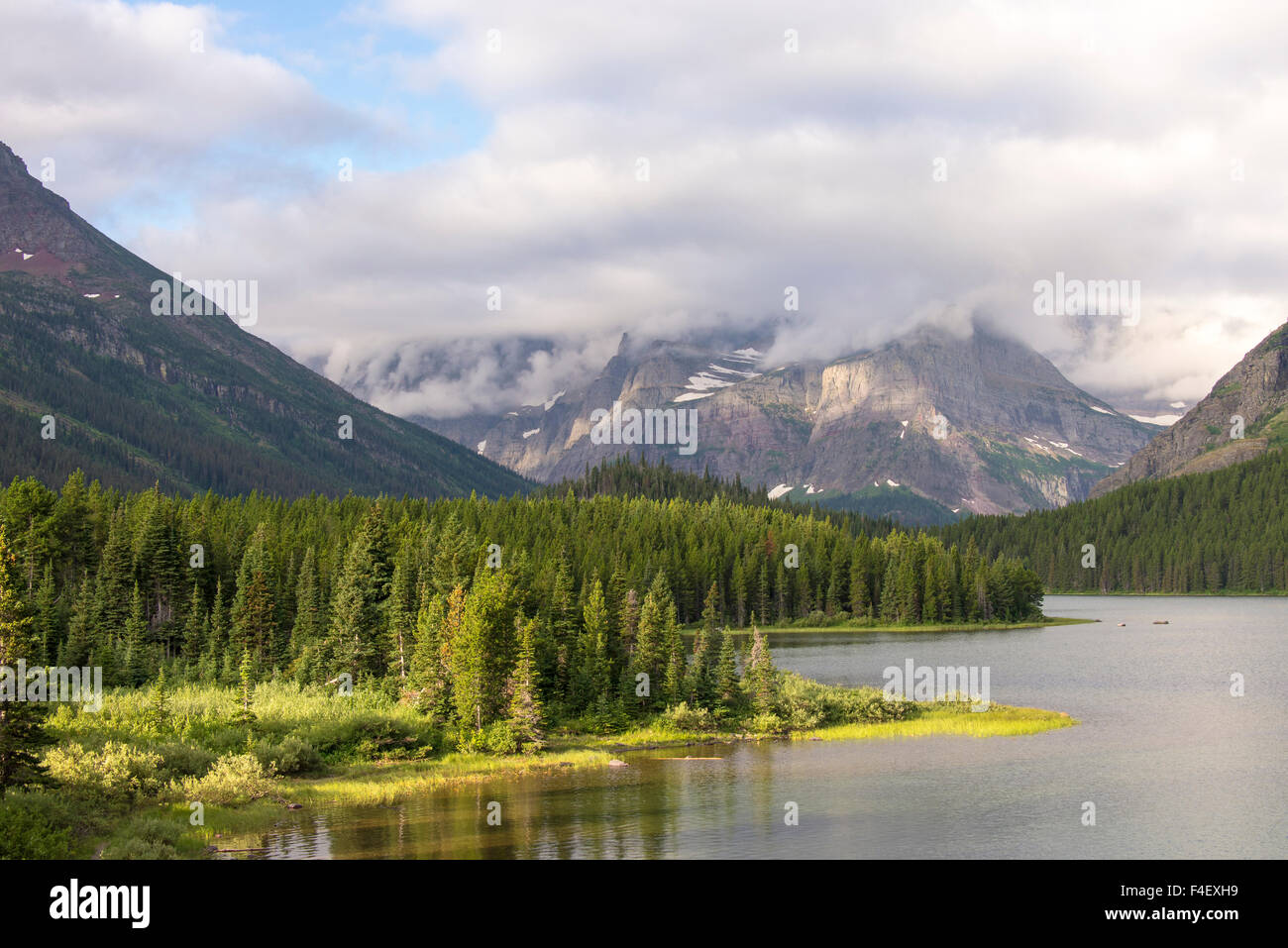 USA, Montana, Glacier National Park. Morning light on Swiftcurrent Lake ...
