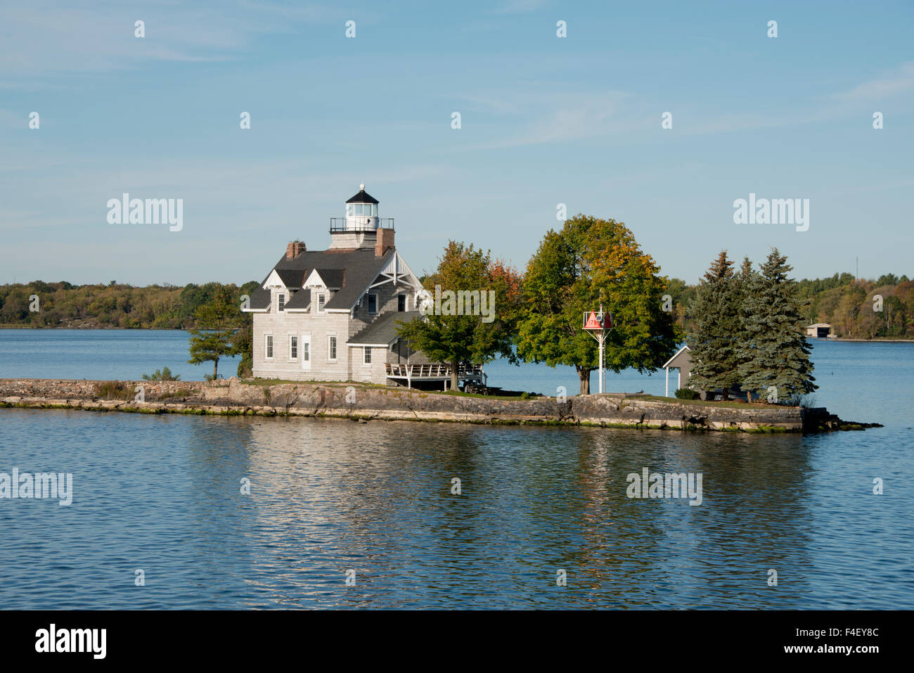 New York, St. Lawrence Seaway, Thousand Islands. Home with lighthouse ...
