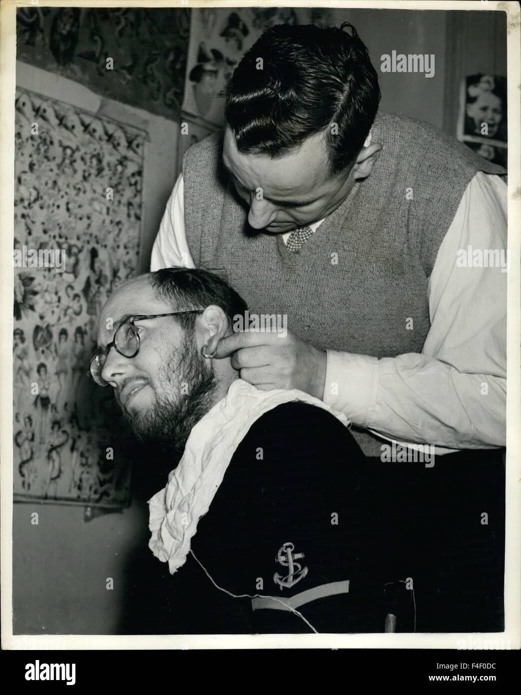 1955 - Sailor from Malaya has his ear pierced - So that he can wear an ...