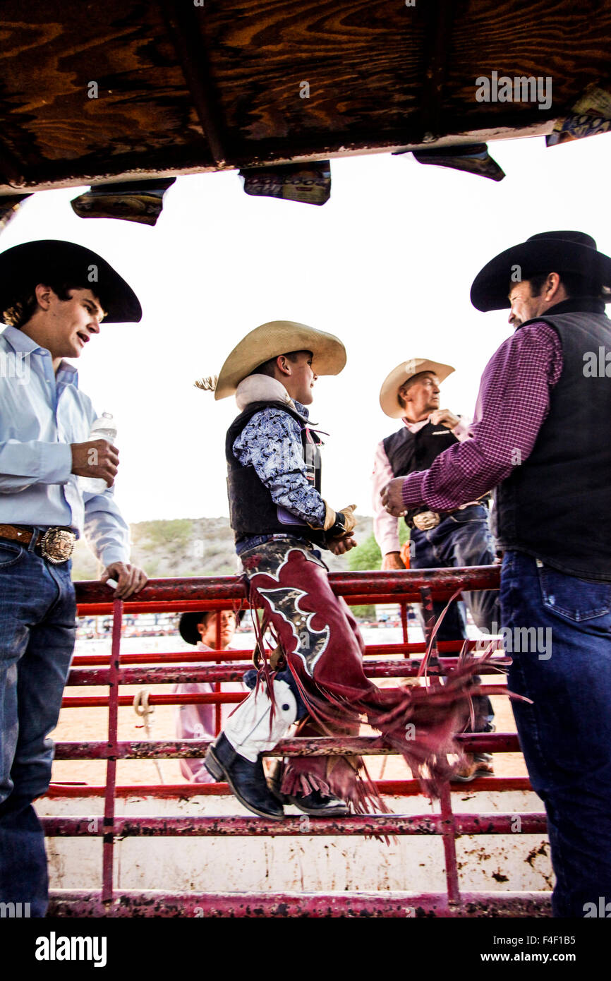 Young boy hangs out with the men at the rodeo, Truth or Consequences ...
