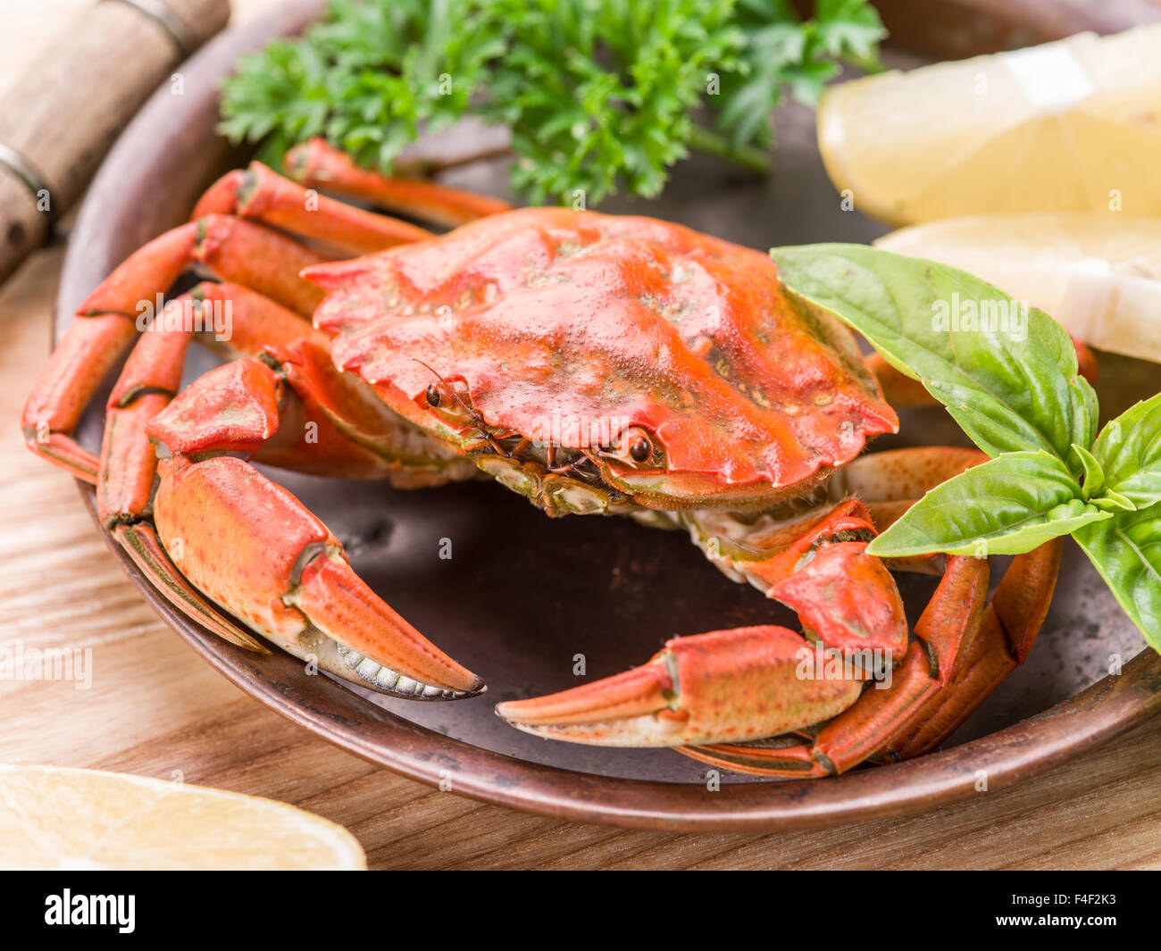 Seafood dish - cooked crab with lemon and herbs Stock Photo - Alamy