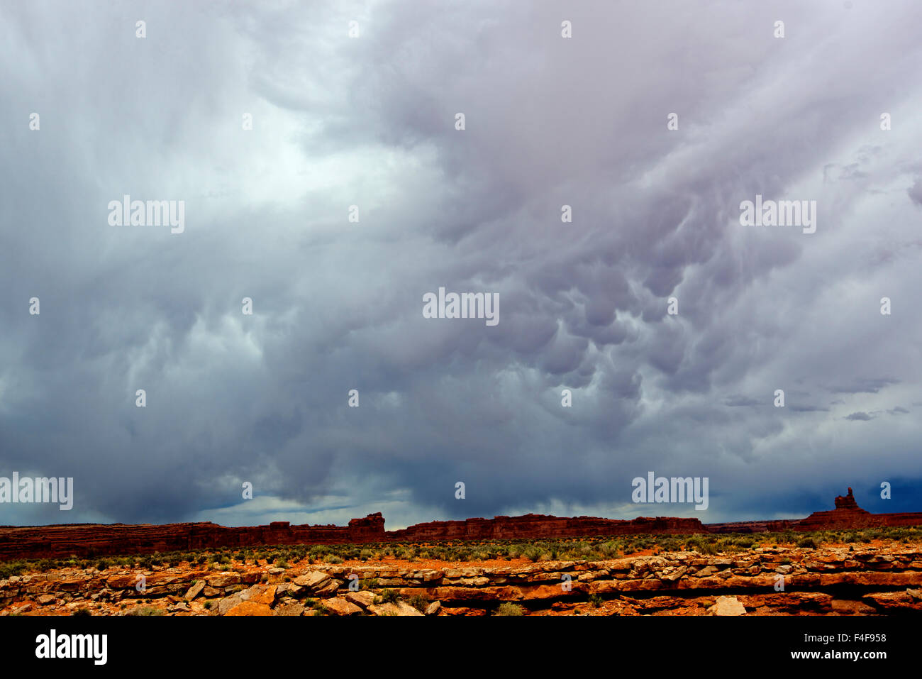 Storm clouds sweep low over the desert landscape near Bluff, Utah and ...