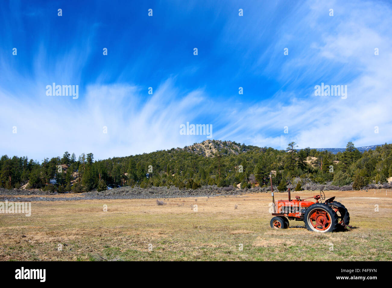 A derelict tractor sits in a deserted field beside Highway 12 in the ...