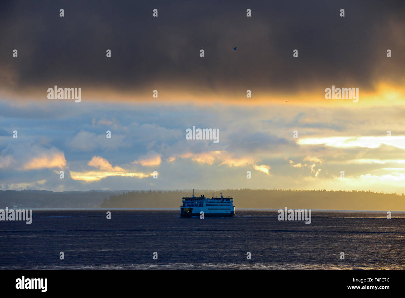 USA, Washington State, Seattle. State ferry crosses Puget Sound under ...