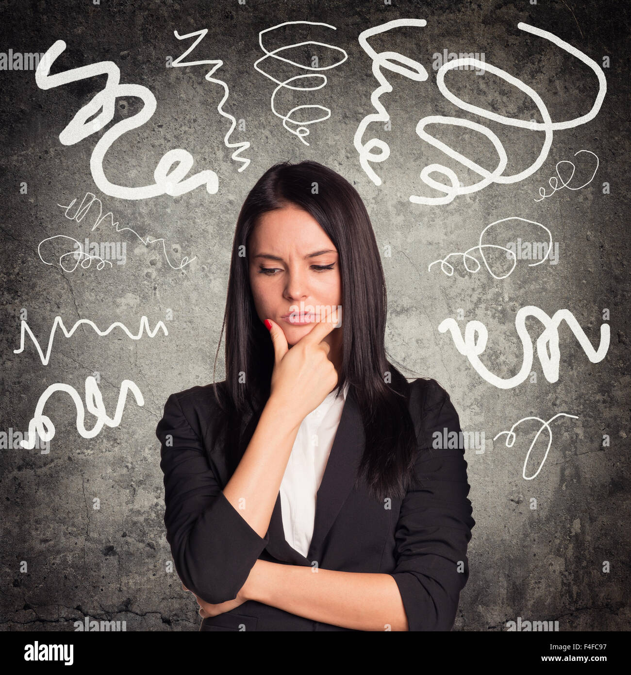 Thinking woman looking down Stock Photo - Alamy