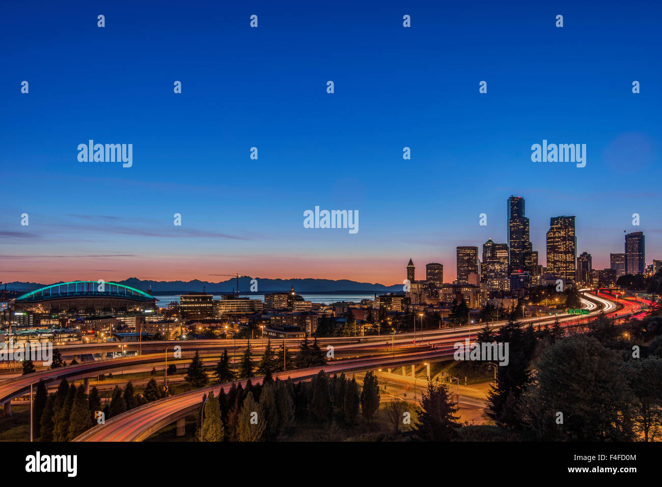 USA, Washington State. The I-5 freeway and downtown Seattle at twilight ...