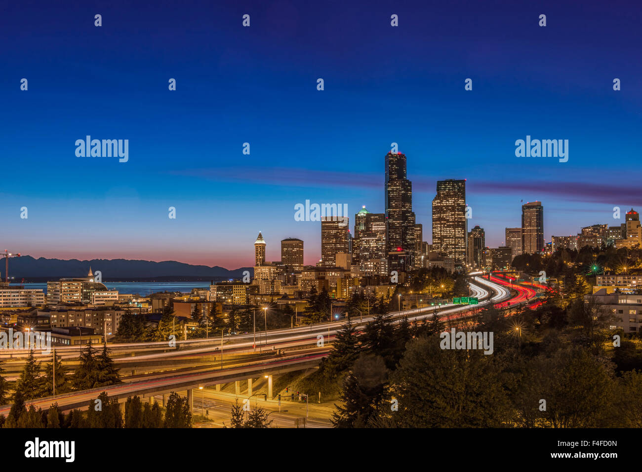 USA, Washington State. The I-5 freeway and downtown Seattle at twilight ...