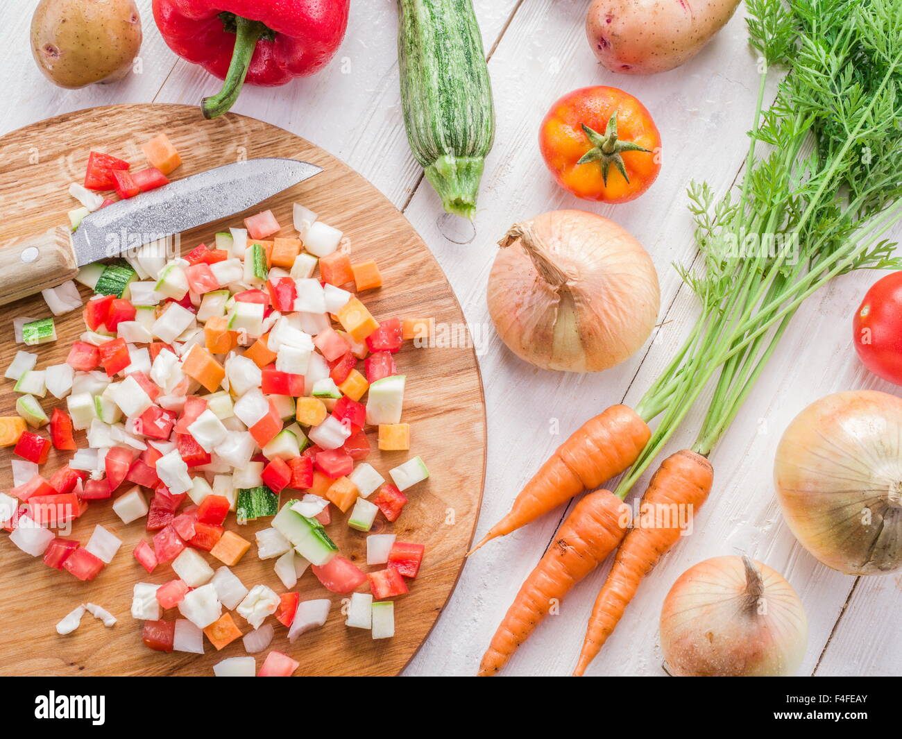 Fresh cut vegetables on the wooden chopping board Stock Photo - Alamy