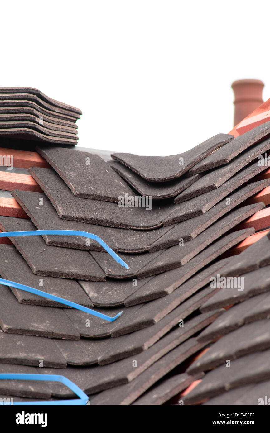 New tiles being fixed in the gully corner area of roof of property ...