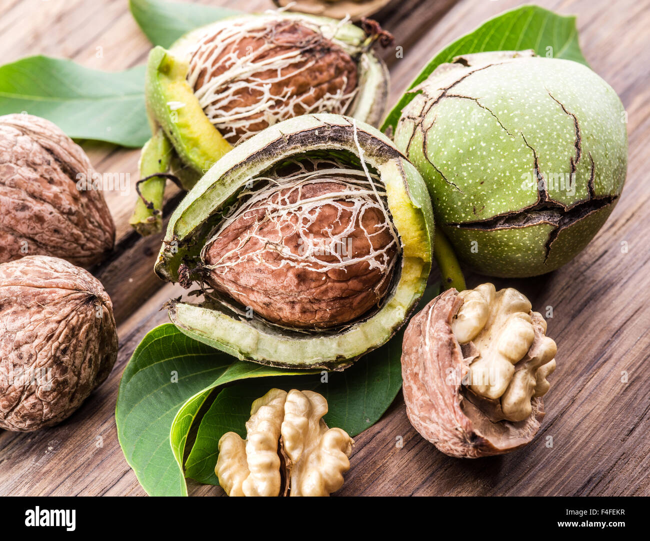 Walnut and walnut kernel on the wooden table Stock Photo - Alamy