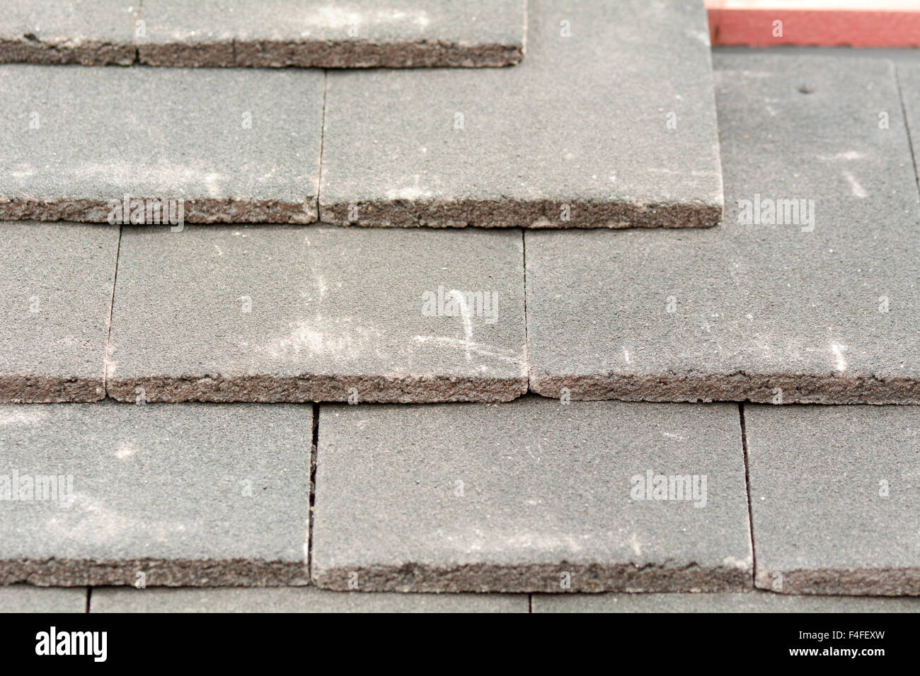 X mark on roof tiles to signify row of tiles to nail to wooden battens ...