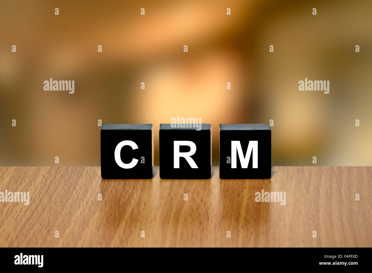 CRM or Customer relationship management on black block with blurred ...