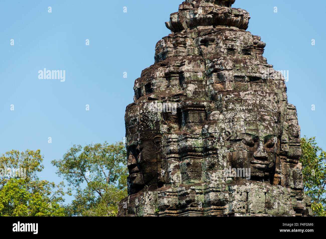 Head encarved in stone Bayon temple angkor Stock Photo - Alamy