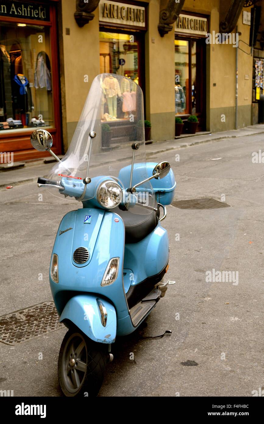 Pale blue vespa motor bike parked on a street in Florence Italy Stock ...