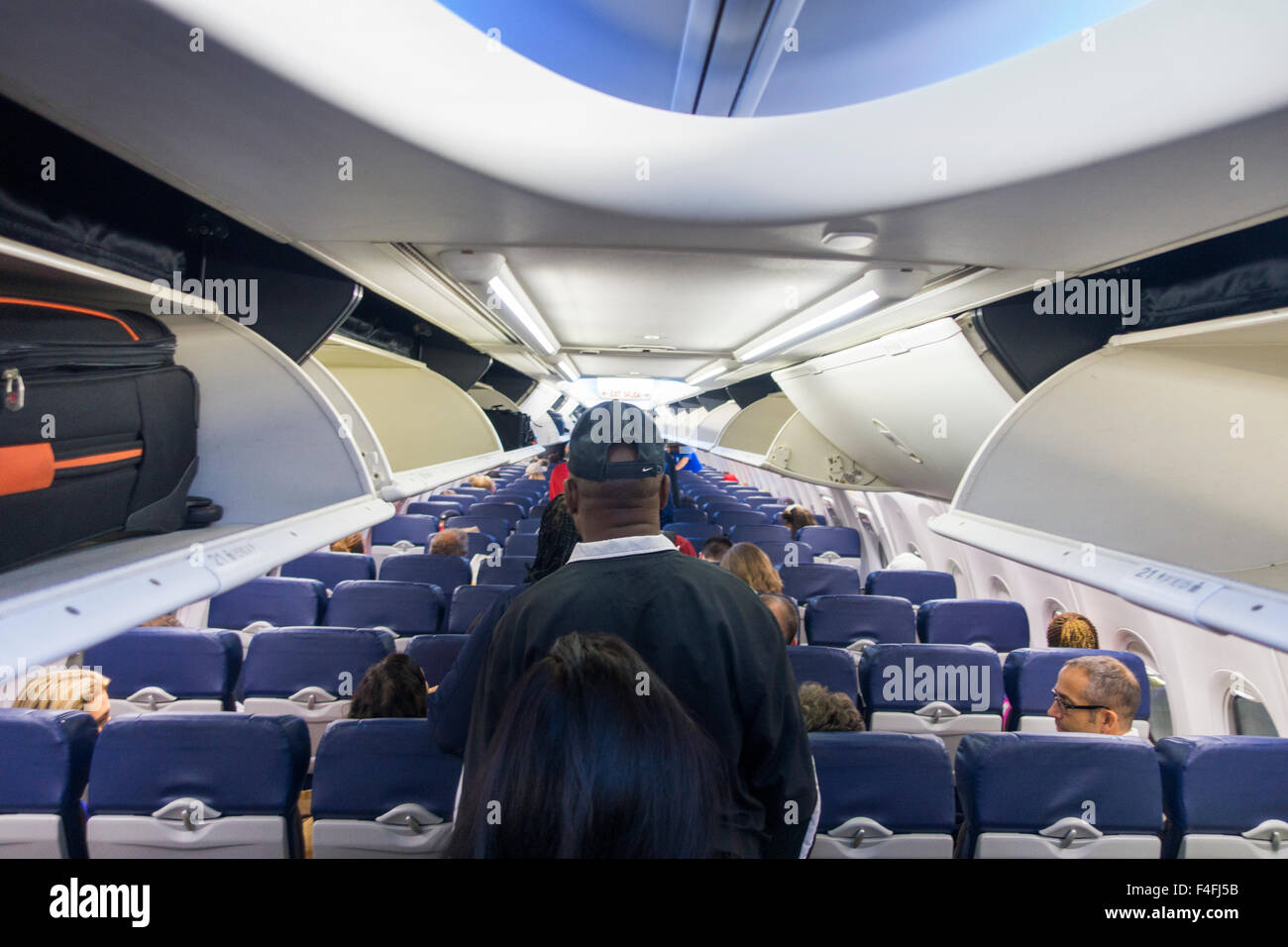 Inside plane cabin passengers getting hi-res stock photography and ...