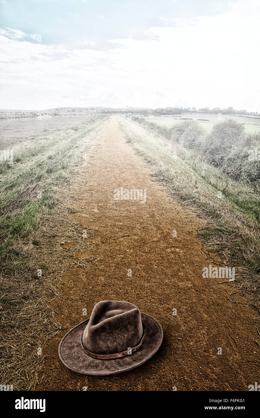 Discarded hat on a dirt track Stock Photo - Alamy