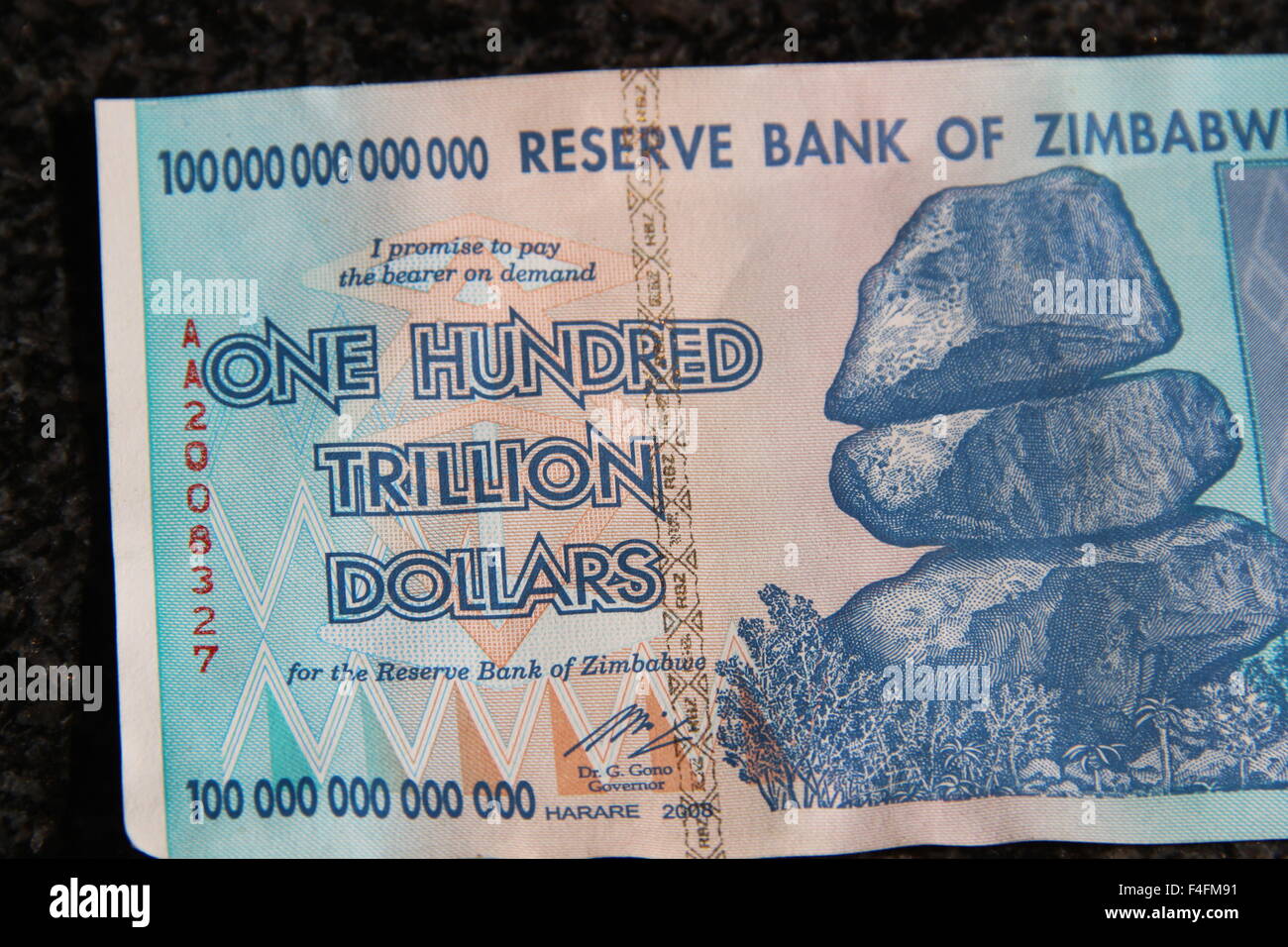 A banknote from Zimbabwe worth one hundred trillion Zimbabwean dollars ...